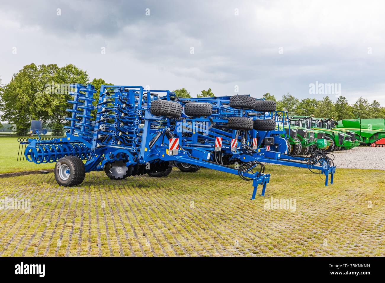 Folding disc harrow cultivator displayed at rural dealership. Kaunas ...