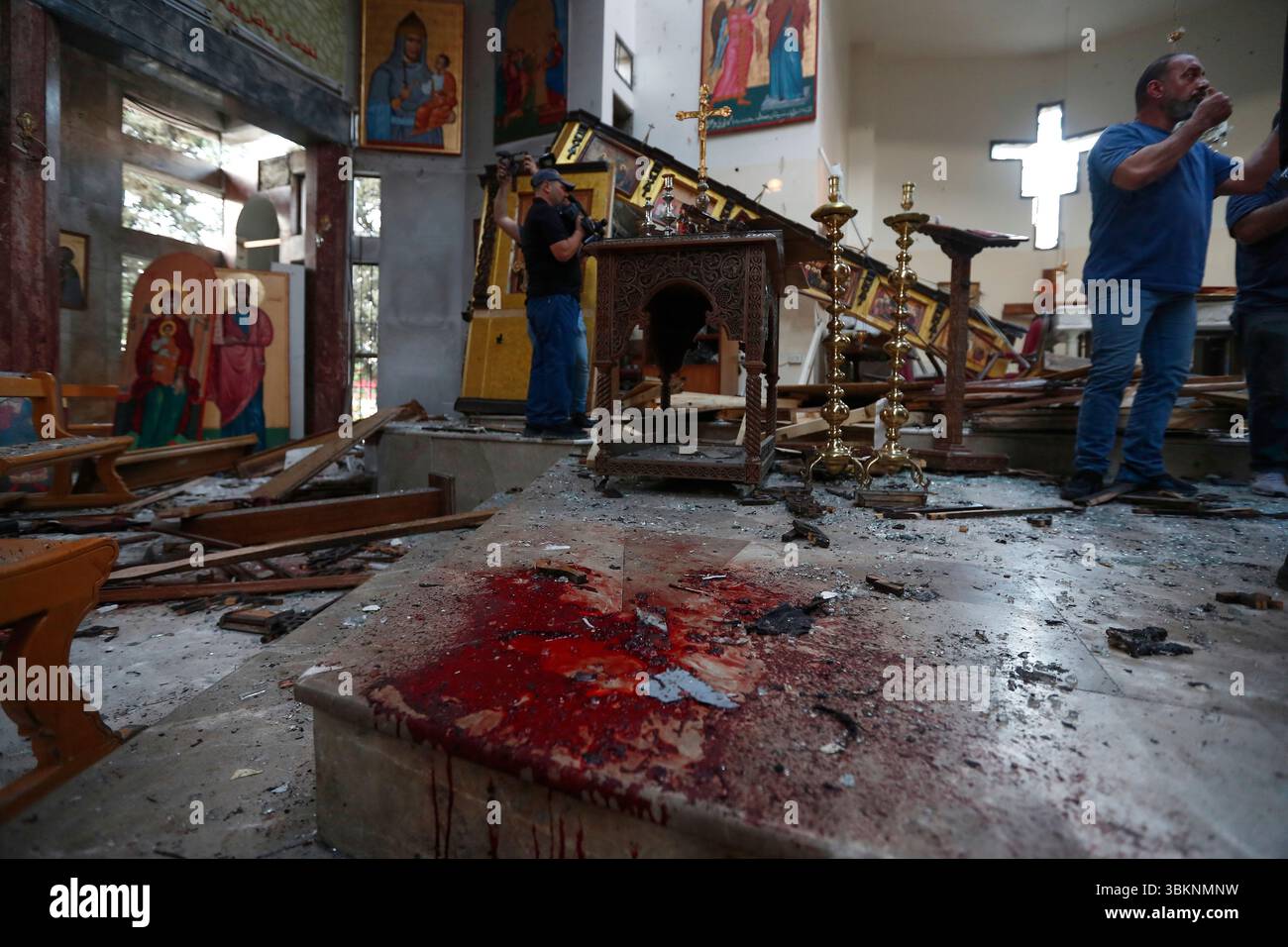 Syrian gather inside Mar Elias church where a suicide bomber detonated ...