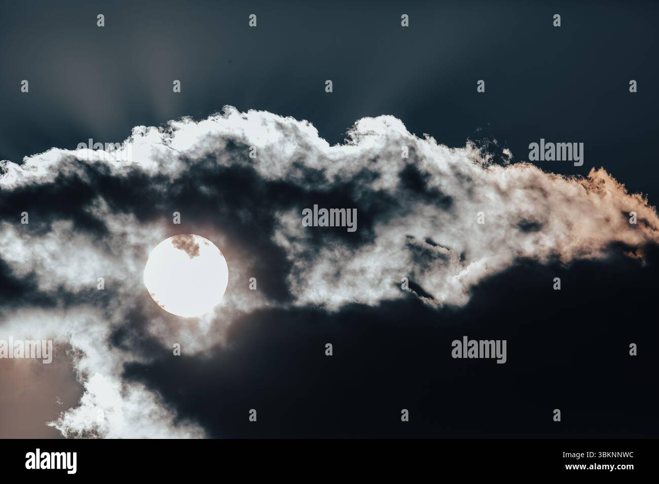 Sunlight Piercing Through Dramatic Clouds Stock Photo - Alamy