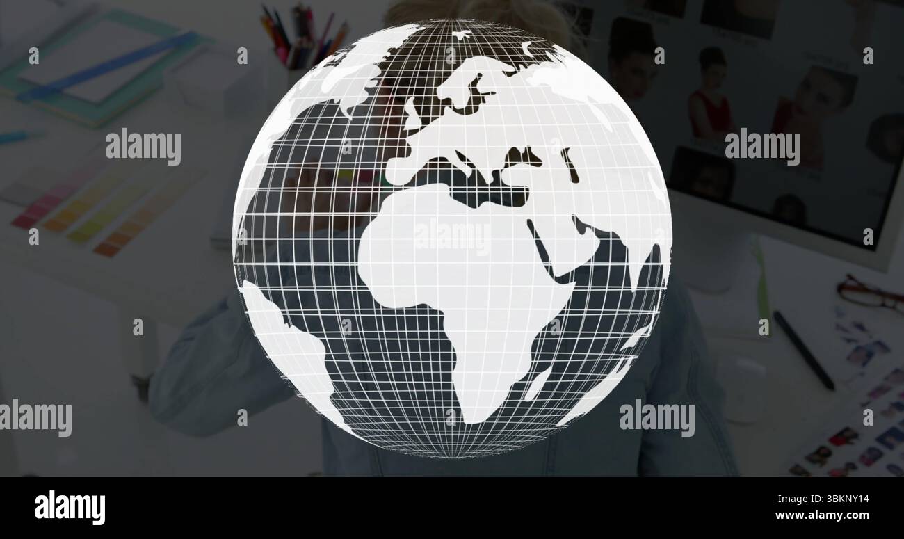 Floating wireframe globe displaying world map above desk at design ...