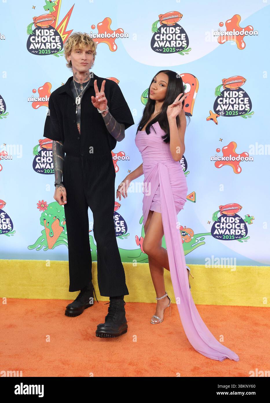 mgk, aka Machine Gun Kelly and Casie Baker attend the 2025 Nickelodeon Kids' Choice Awards at ...