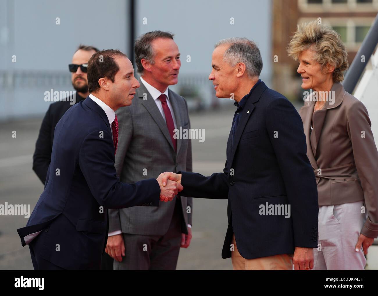 Prime Minister Mark Carney is greeted by Nicholas Brousseau, Canadian ...