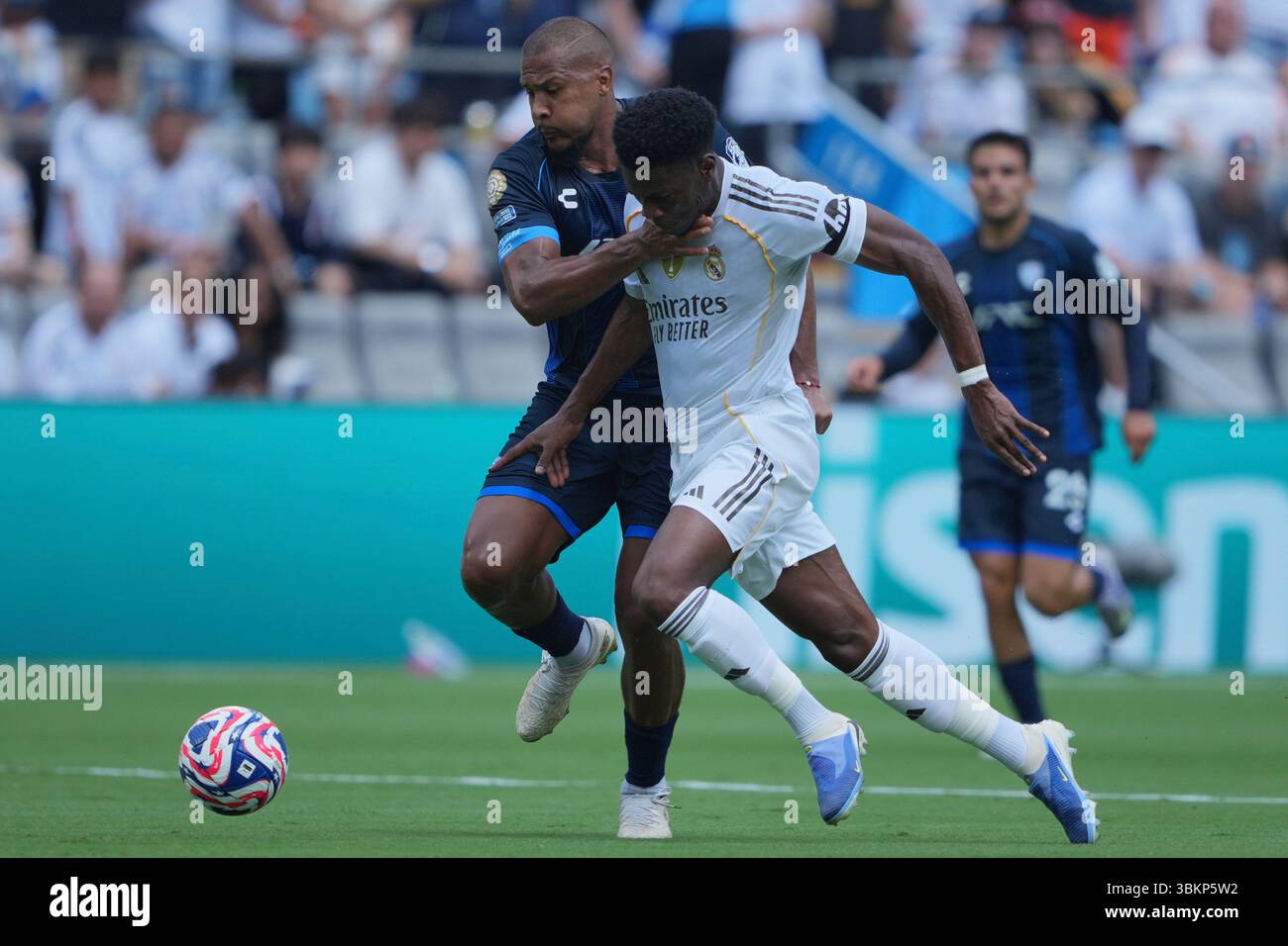 Real Madrid's Aurelien Tchouameni, front, and Pachuca's Salomon Rondon ...