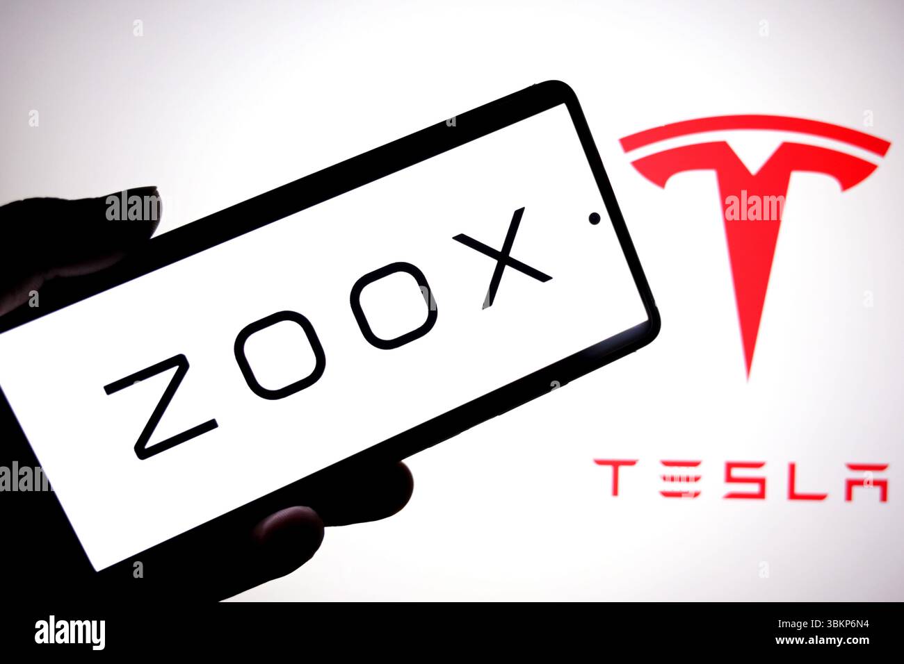 In this photo illustration, a Zoox logo is seen displayed on a ...