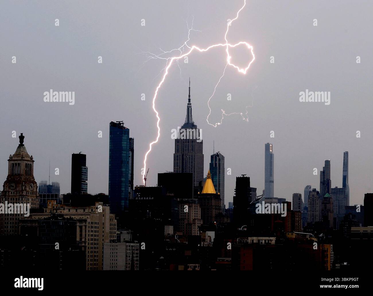 New York, United States. 22nd June, 2025. A bolt of lightning strikes ...