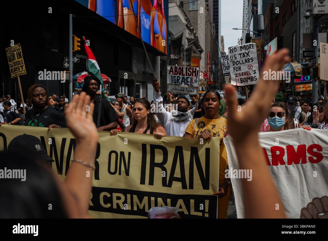 Protester shouts slogans while carrying banners during a protest ...