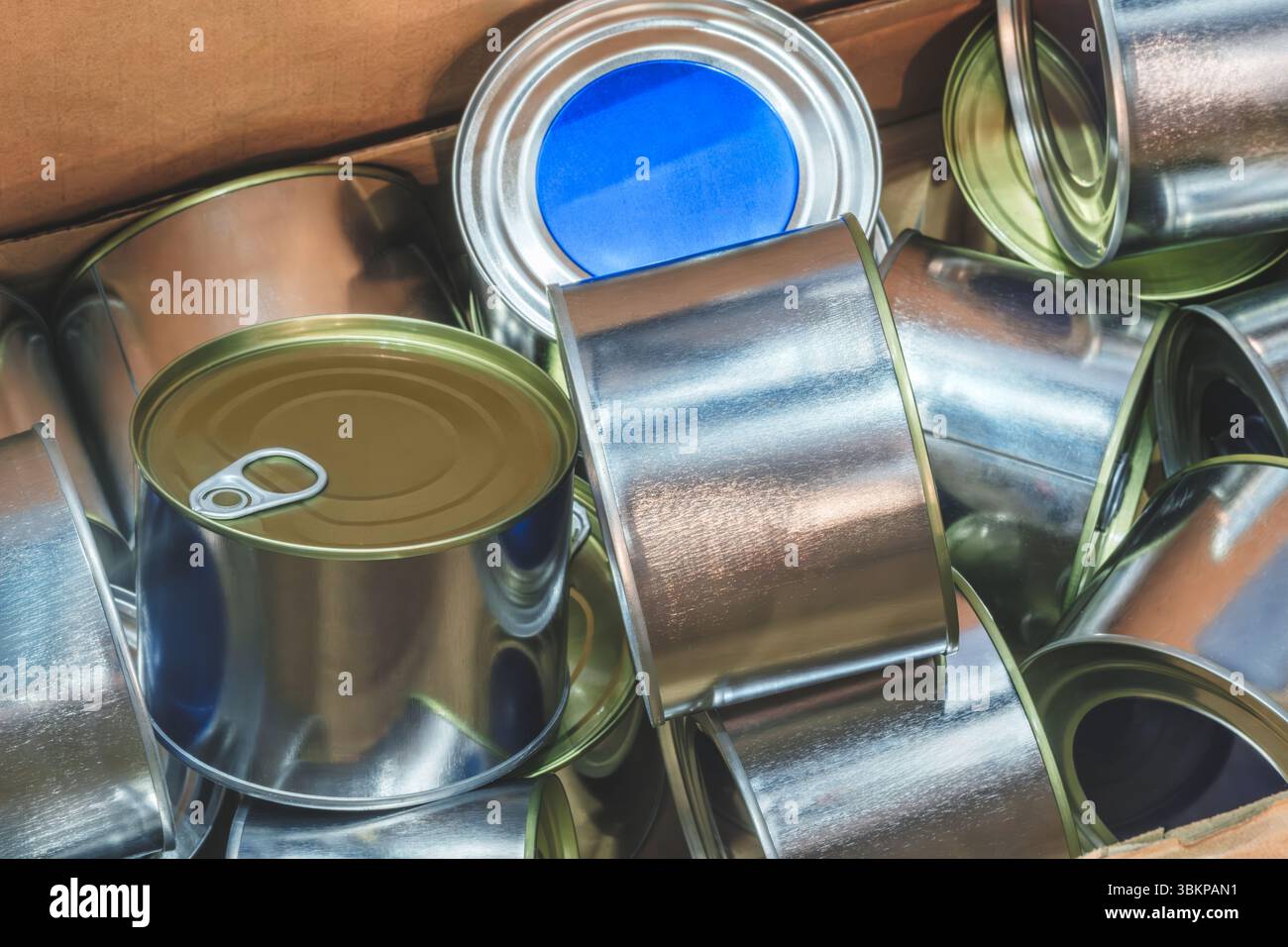 Box full of metal cans as background food production concept Stock ...