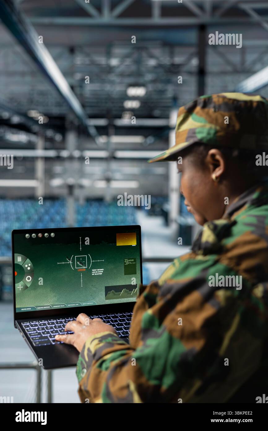 Close up of army expert in data center scanning terrain in real time ...