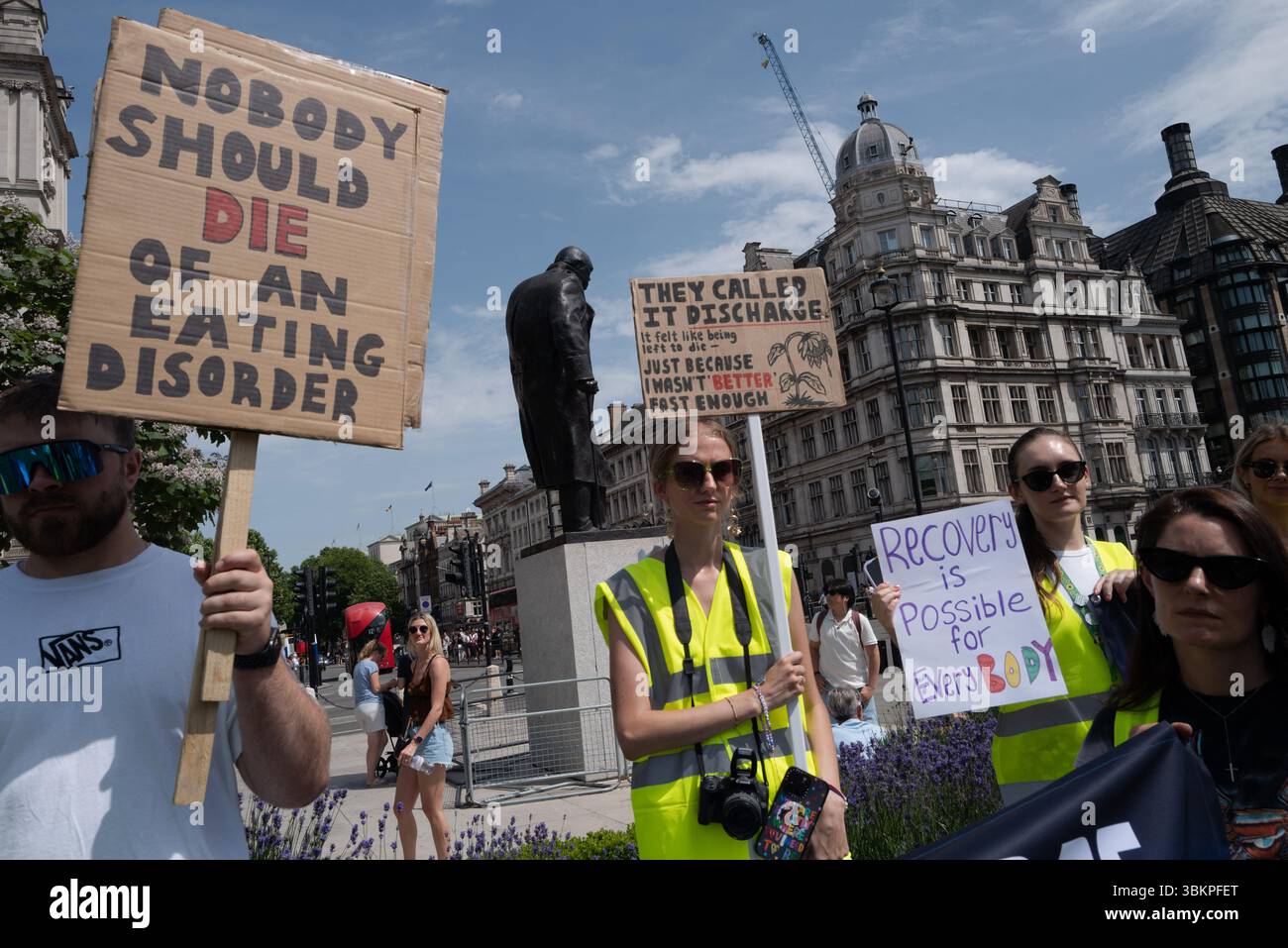 Supporters of eating disorder reform gather at Parliament Square for a ...