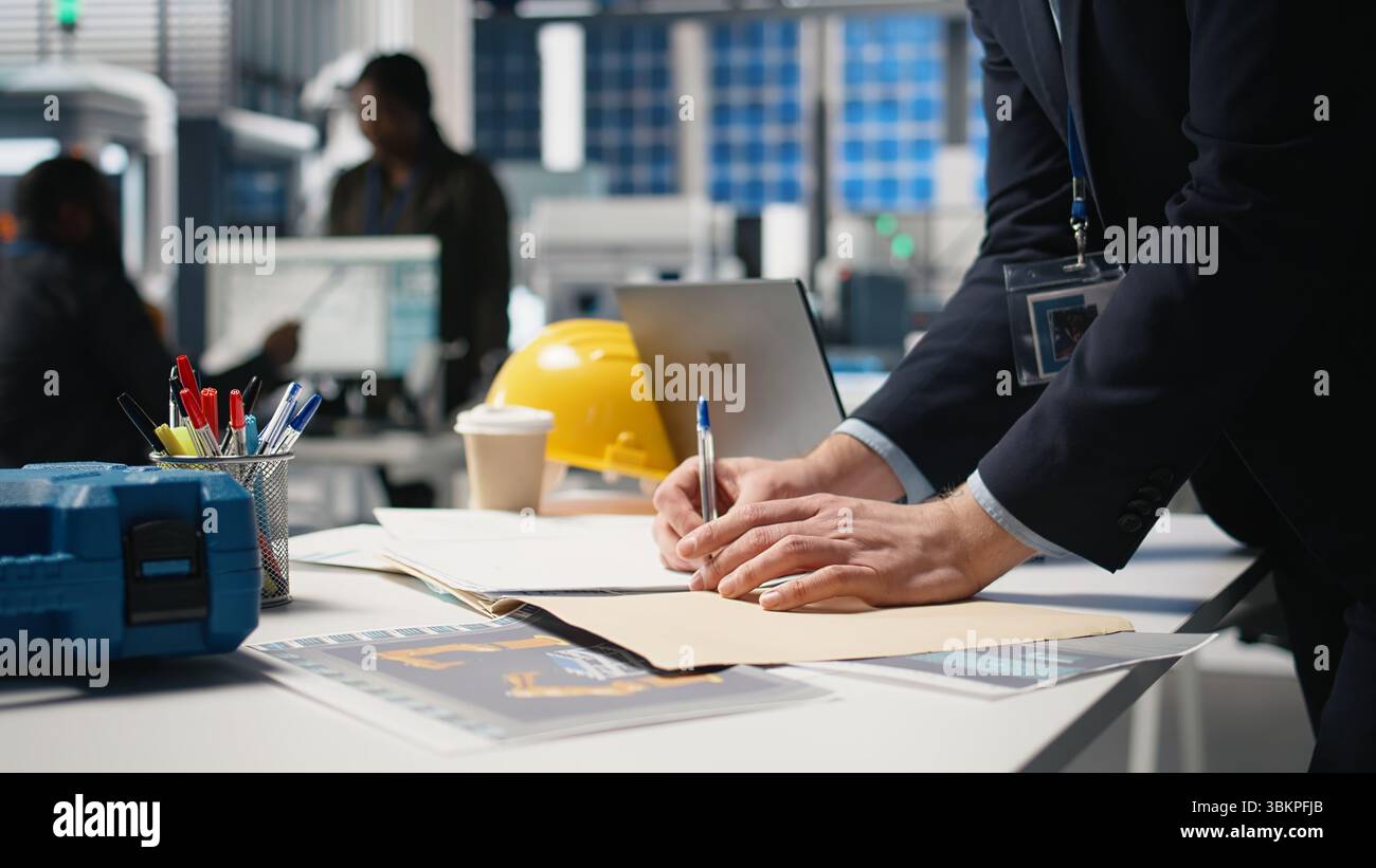 Professional inspector reviewing manufacturing process hi-res stock ...
