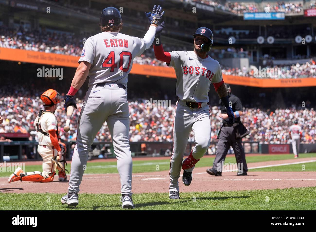 Boston Red Sox' Ceddanne Rafaela, right, is congratulated by Nate Eaton ...