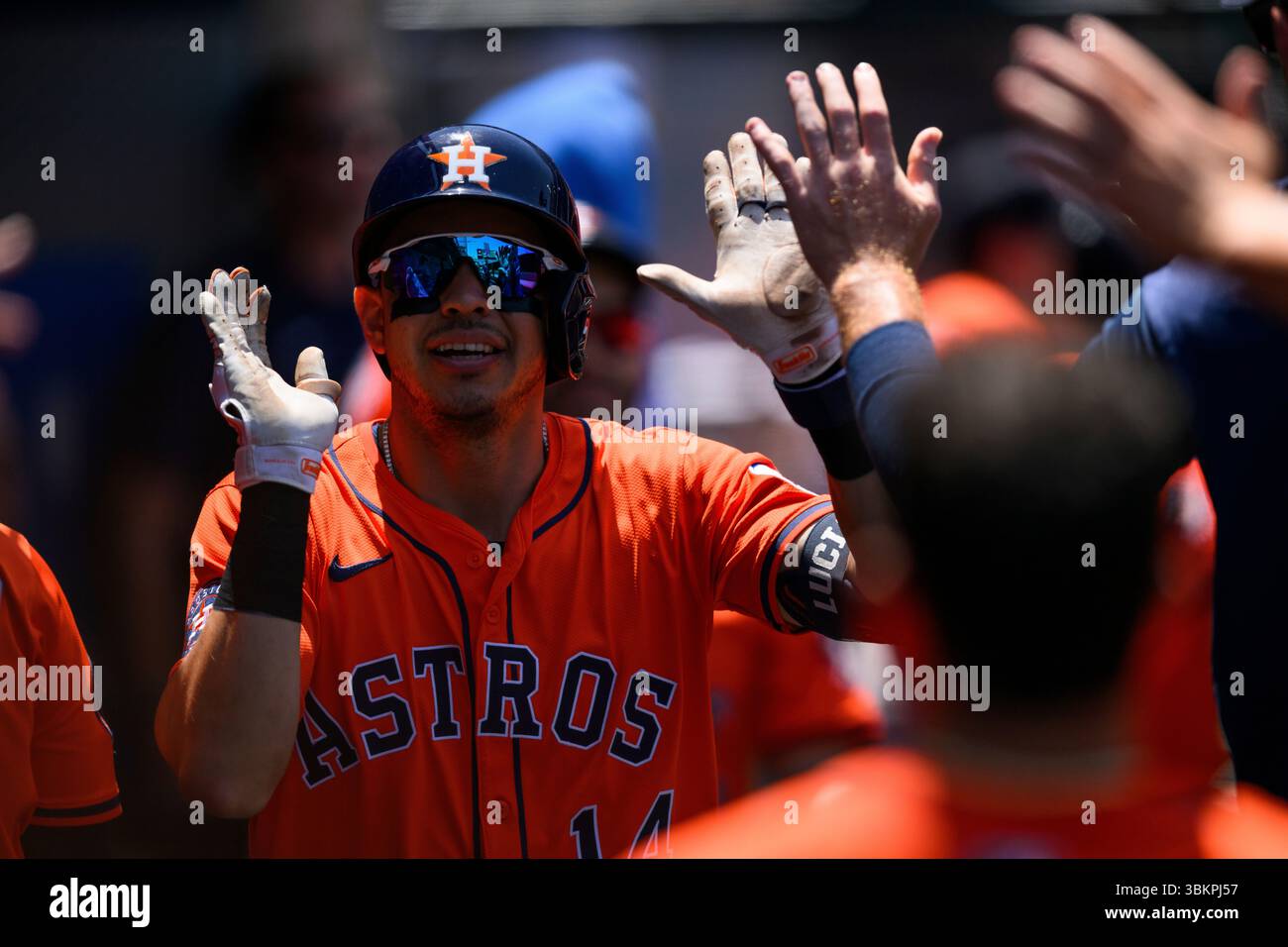 Houston Astros' Mauricio Dubón celebrates with teammates after hitting ...