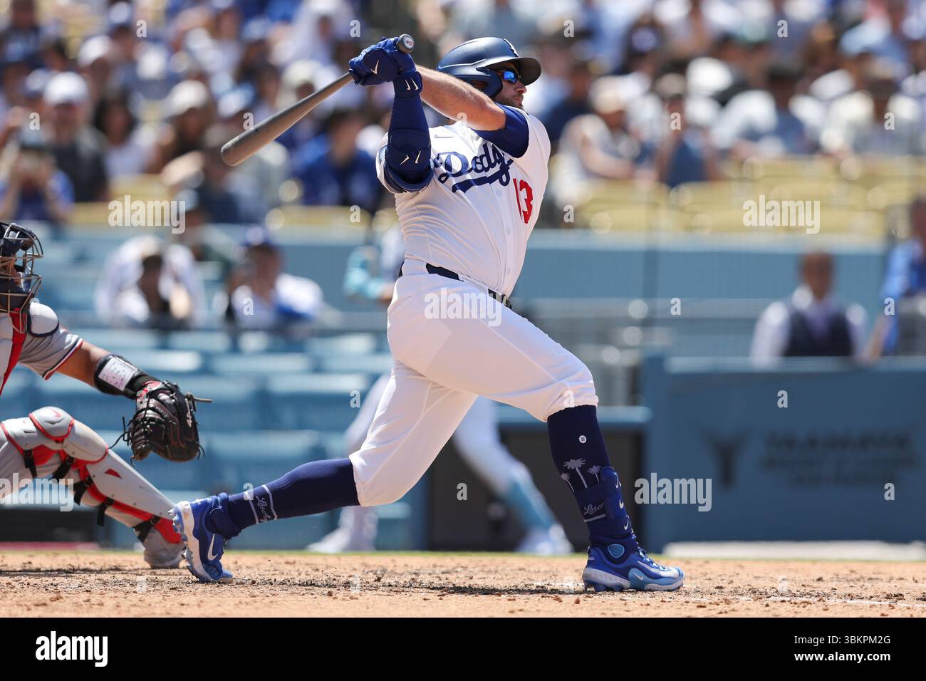 Los Angeles Dodgers' Max Muncy follows through on a grand slam during ...