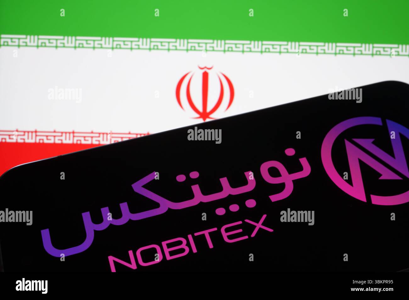 Nobitex app logo in Persian on smartphone screen in front of Iranian ...