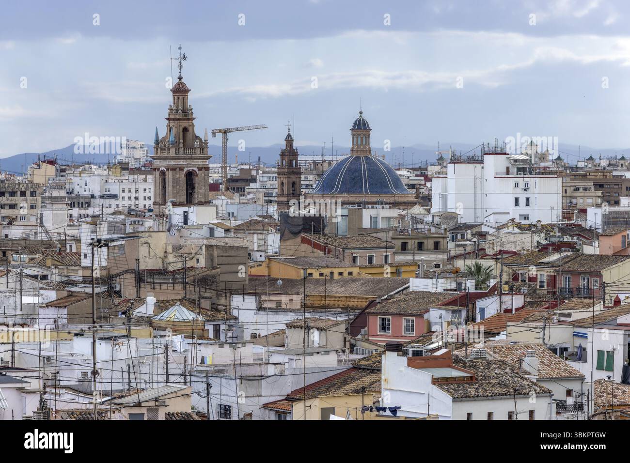 Panorama of the rooftops of Valencia with the tower and dome of the ...