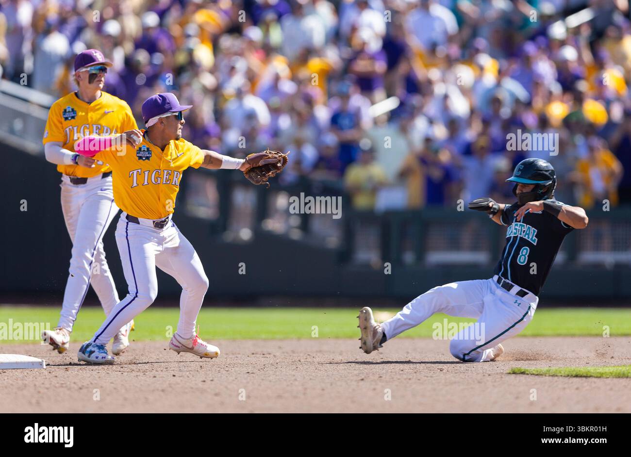 LSU's Steven Milam, left, forces out Coastal Carolina's Dean Mihos at ...