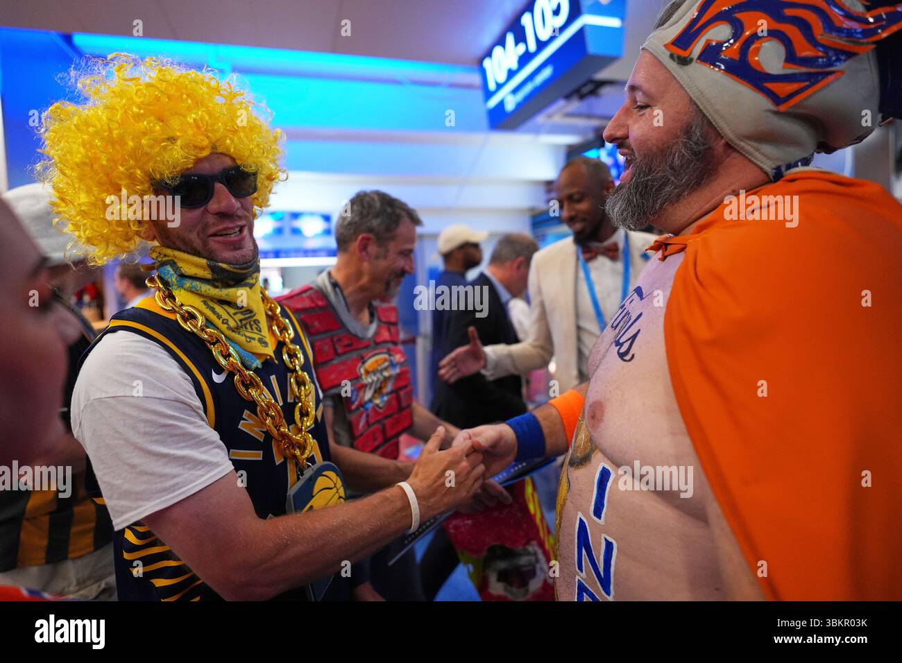 An Indiana Pacers fan greets "Thundor" Garrett Havil, right, before ...