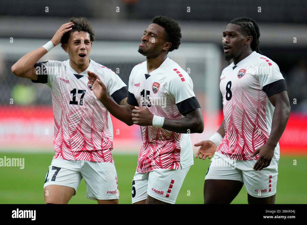 Trinidad and Tobago's Dante Sealy, center, celebrates after scoring ...