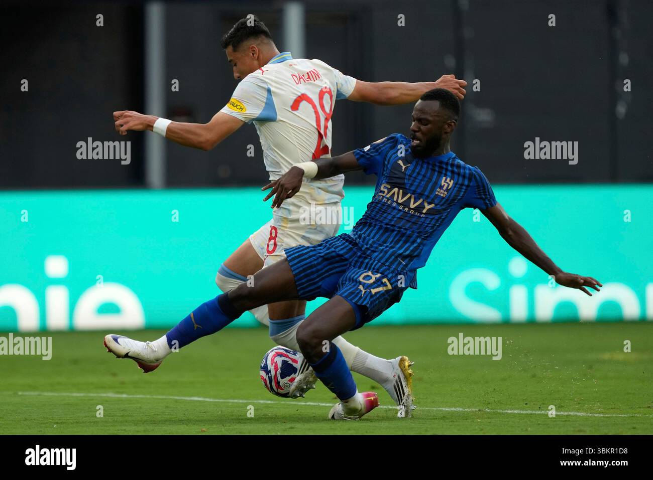 Red Bull Salzburg's Adam Daghim is challenged by Al-Hilal's Hassan Al ...