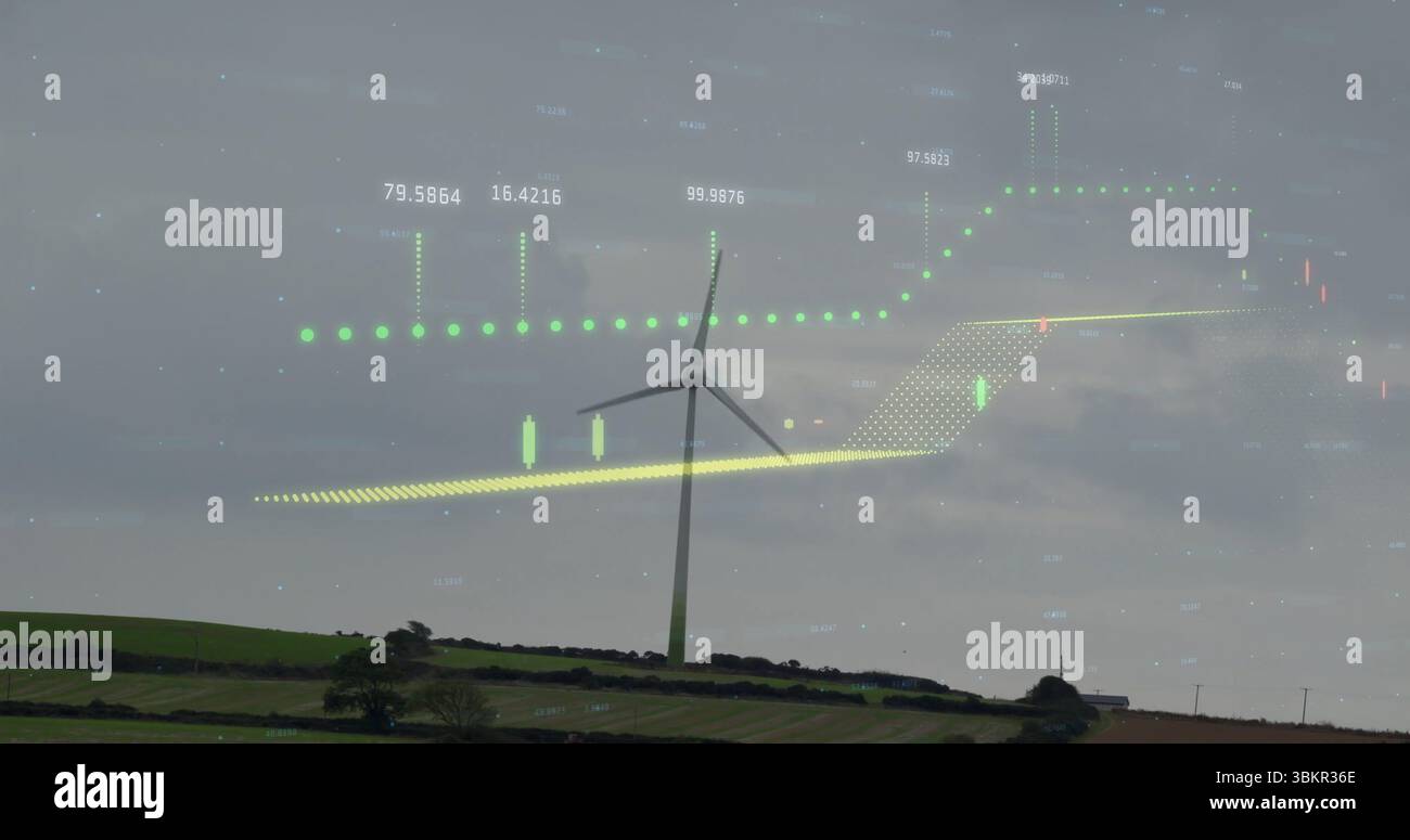 Rotating wind turbine rising above farmland with hedgerows, with ...
