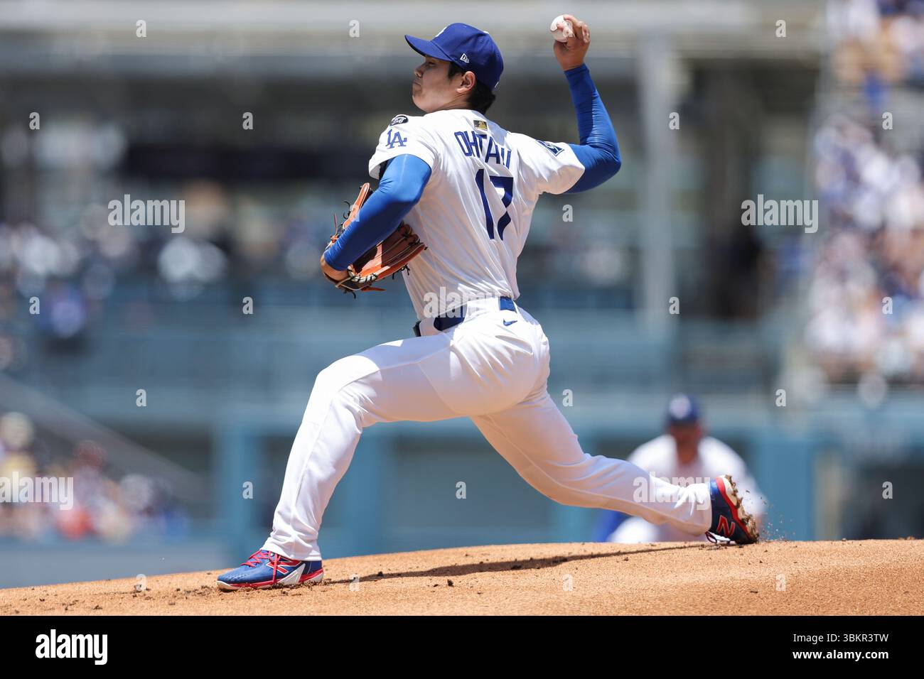 Los Angeles Dodgers starting pitcher Shohei Ohtani throws to a ...