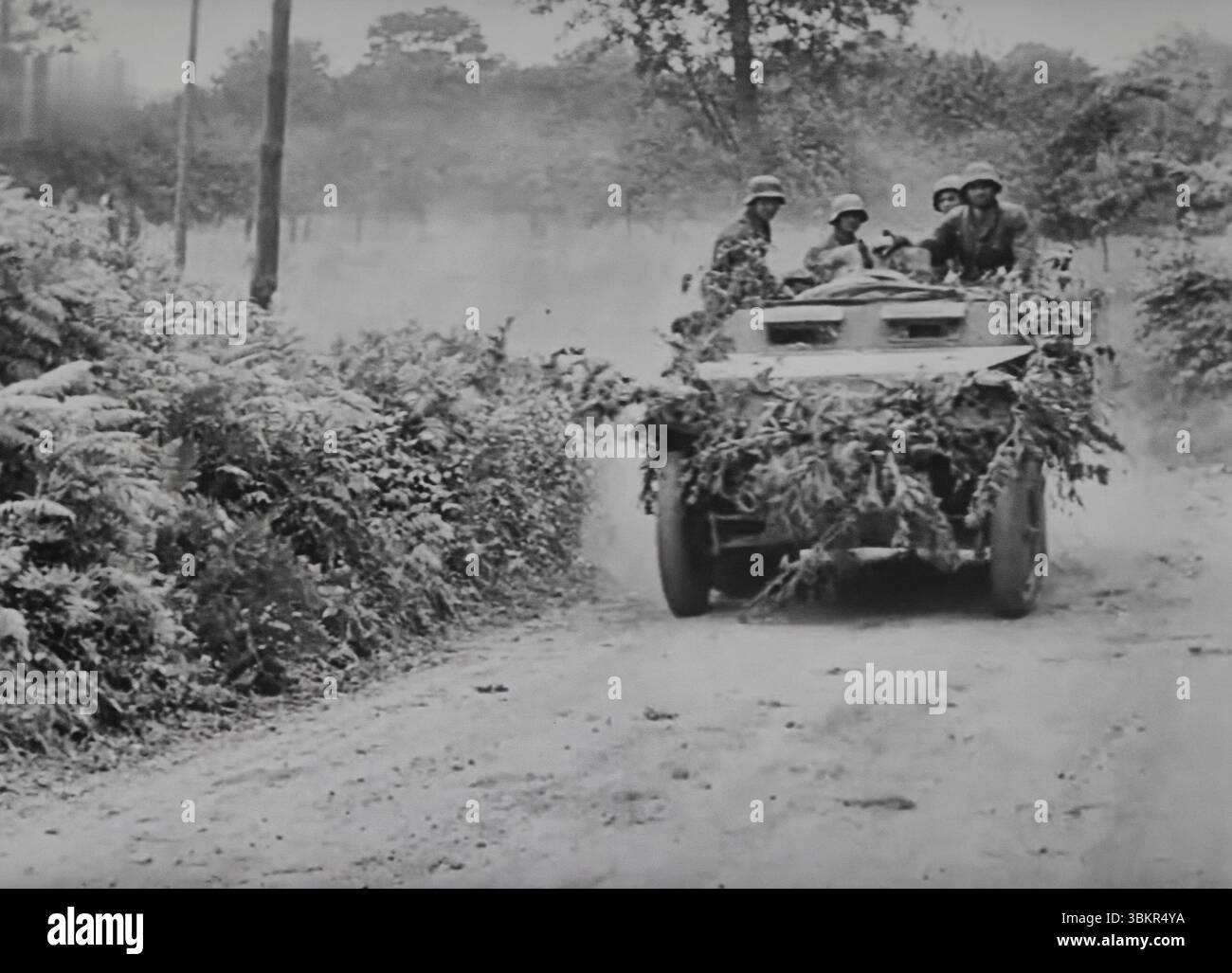 WW2 Screen B&W Still a German Camouflaged Halftrack advances towards ...
