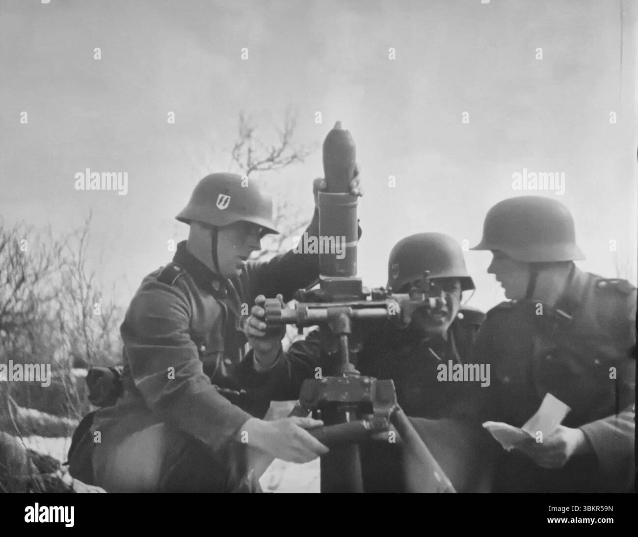 WW2 Screen B&W Still Waffen SS from the Totenkopf Division load an 8cm ...