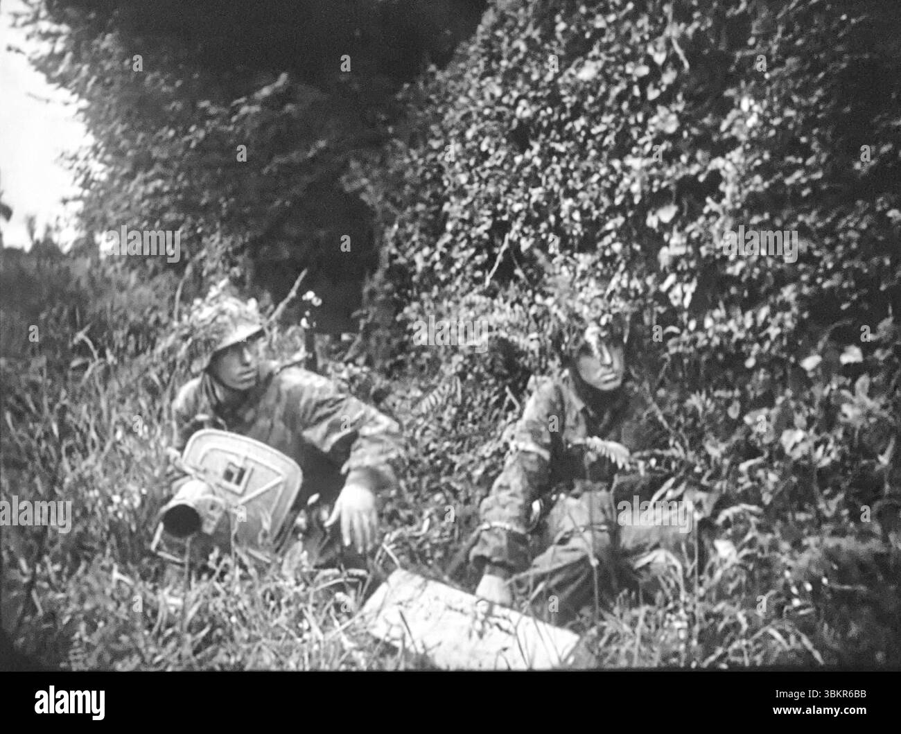WW2 Screen B&W Still German Troops Heavily Camouflaged move their ...