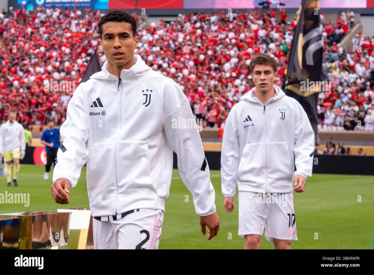 Juventus' Alberto Costa, left, and Kenan Yıldız, right, come out for ...