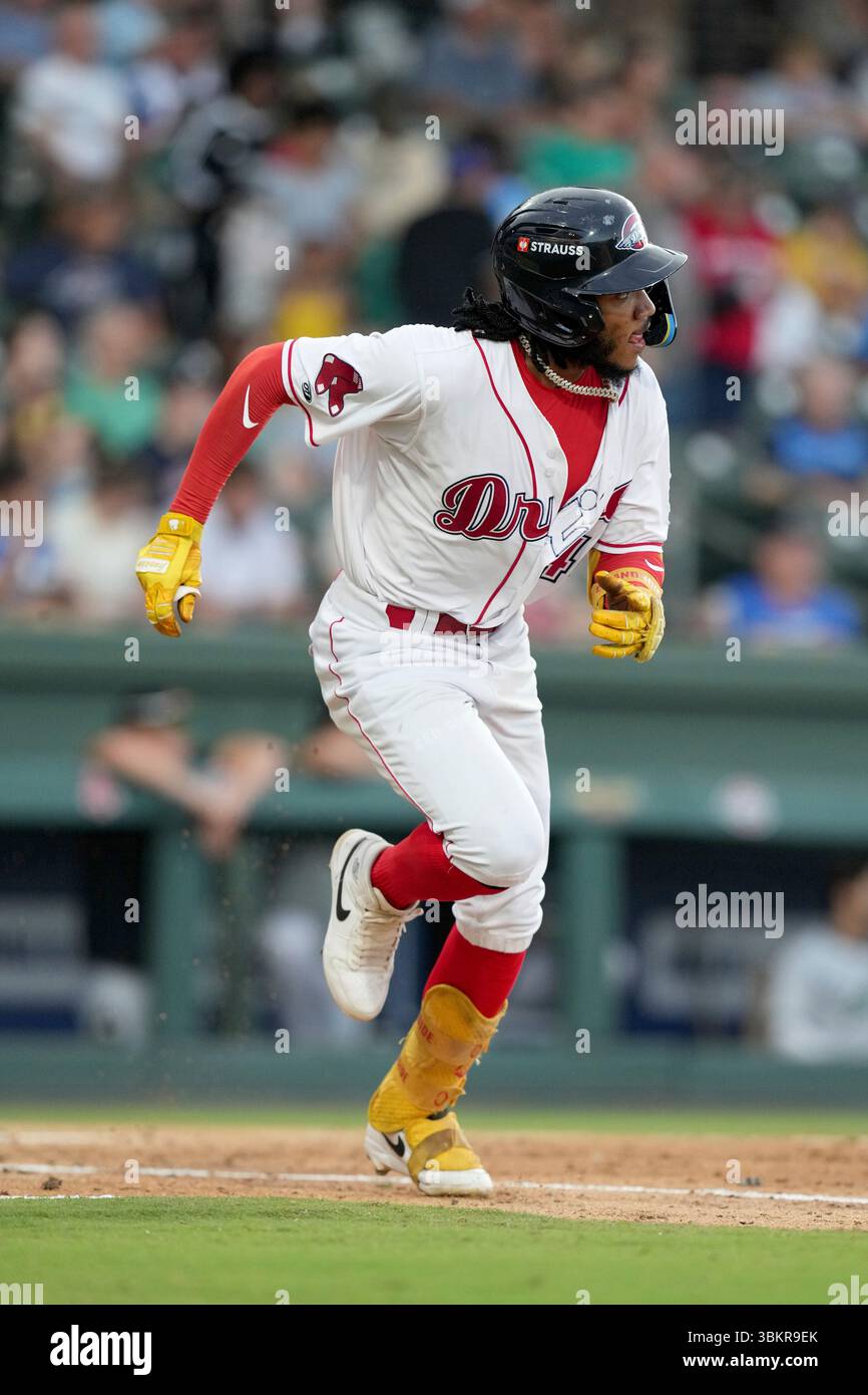 Miguel Bleis (48) of the Greenville Drive runs toward first base in a ...