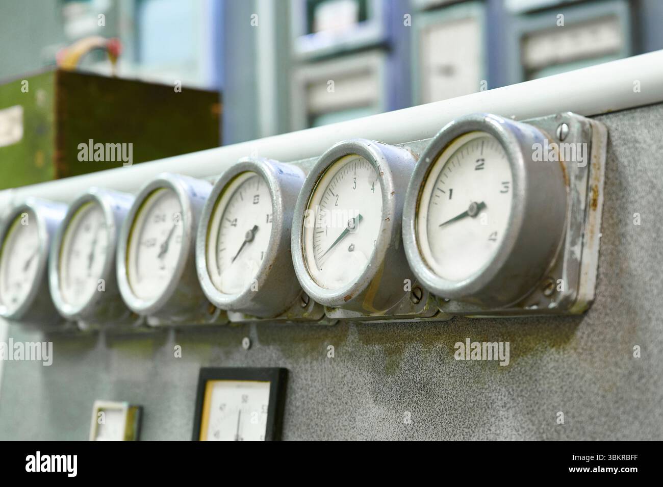 Antique gauges display measurements in a vintage industrial control ...