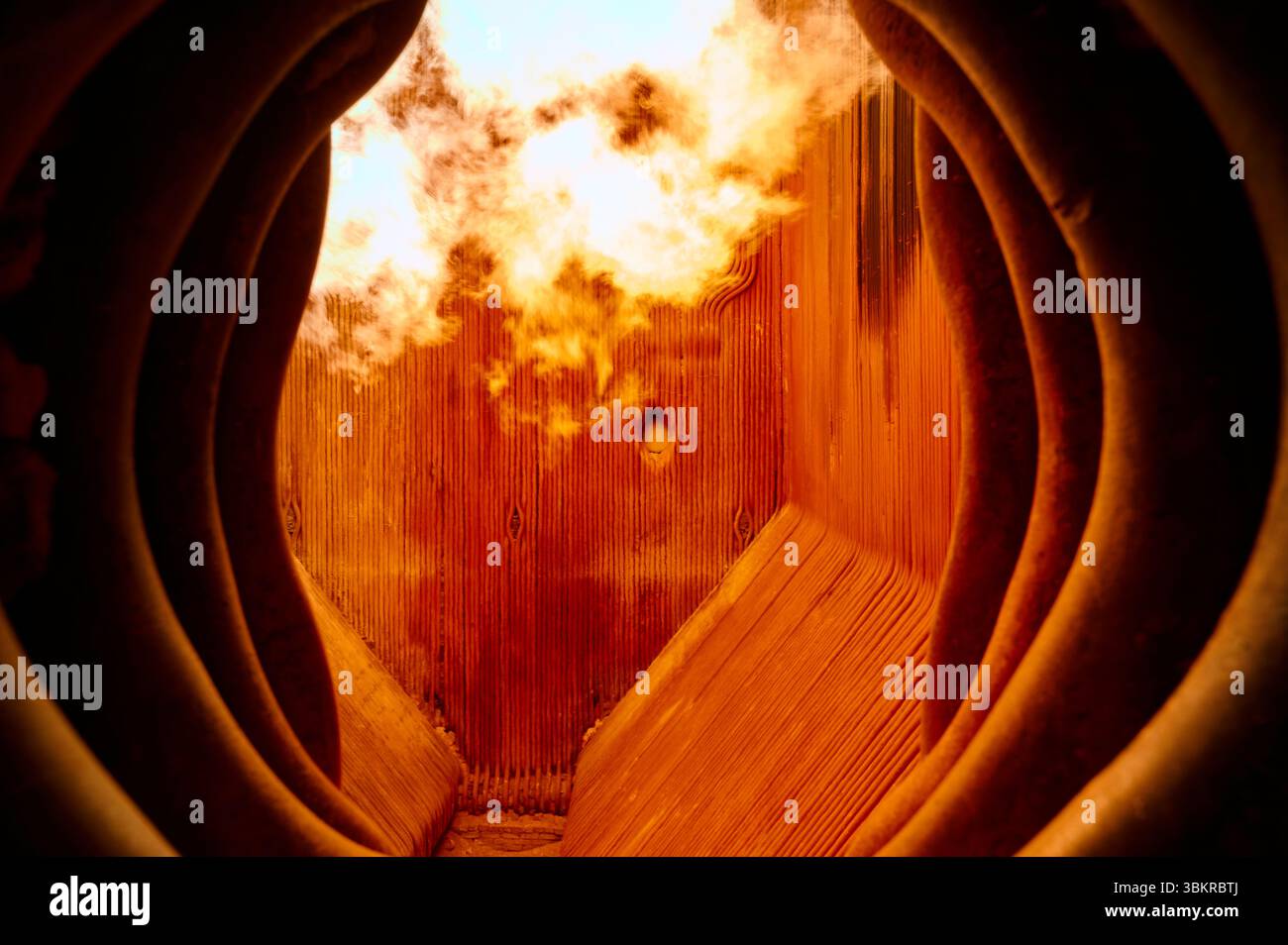 Interior view of operating steam boiler furnace showing flame ...