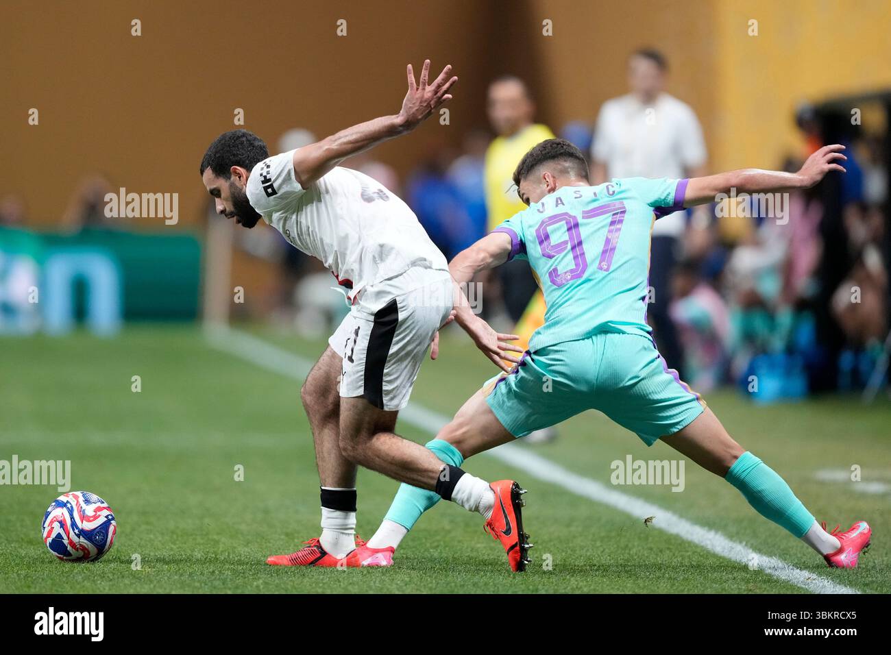 Manchester City's Rayan Ait-Nouri, left, and Al Ain's Adis Jasic fight ...