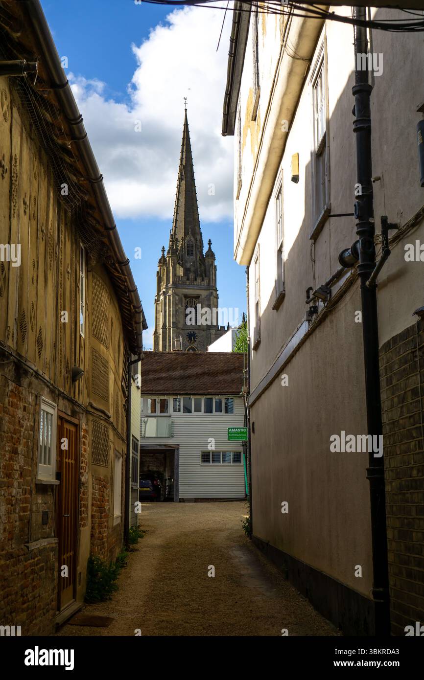 A striking view down a narrow street in Saffron Walden, England, with a ...