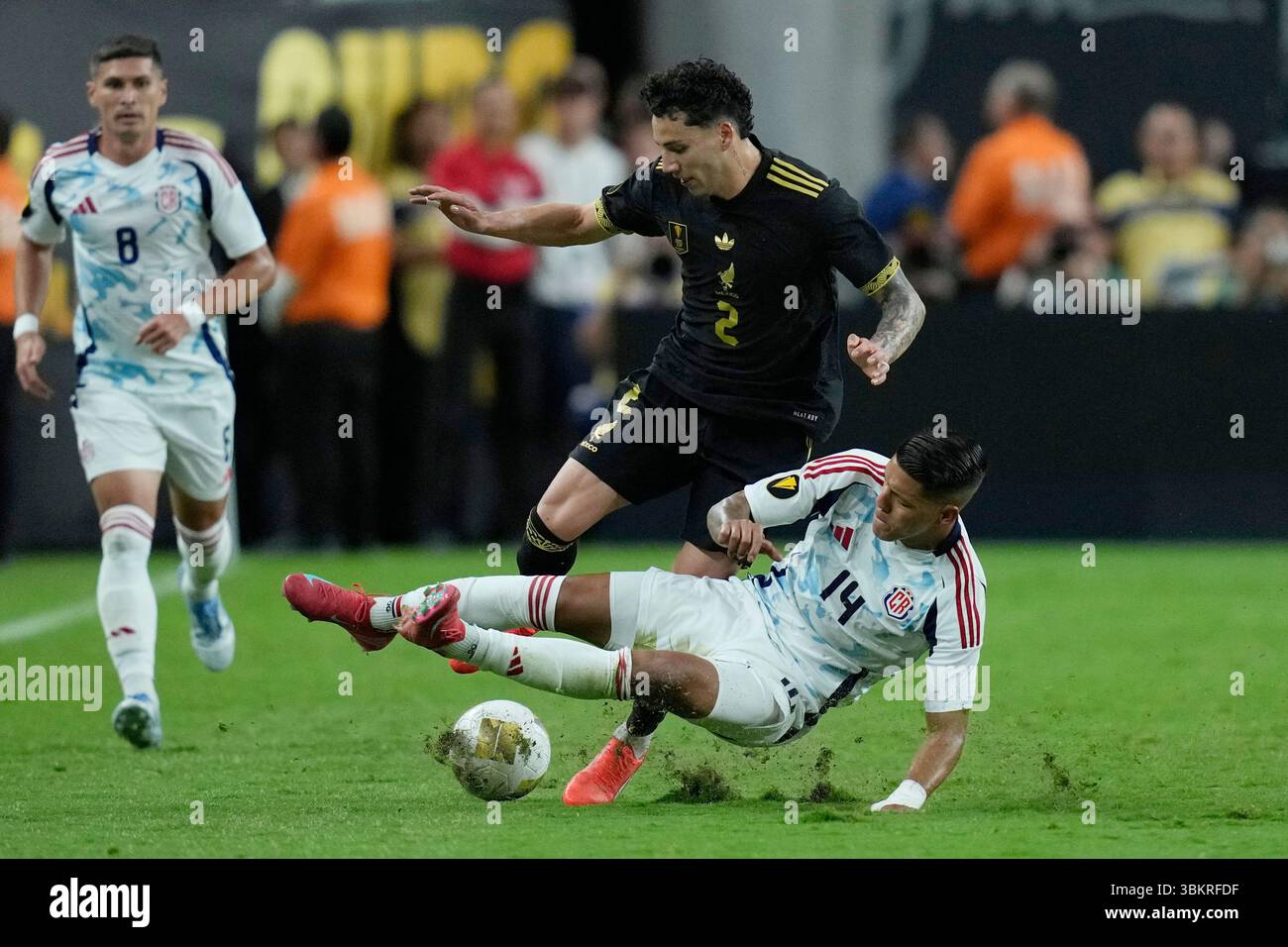 Costa Rica's Orlando Galo tackles Mexico's Jorge Sanchez during a CONCACAF Gold Cup soccer match ...