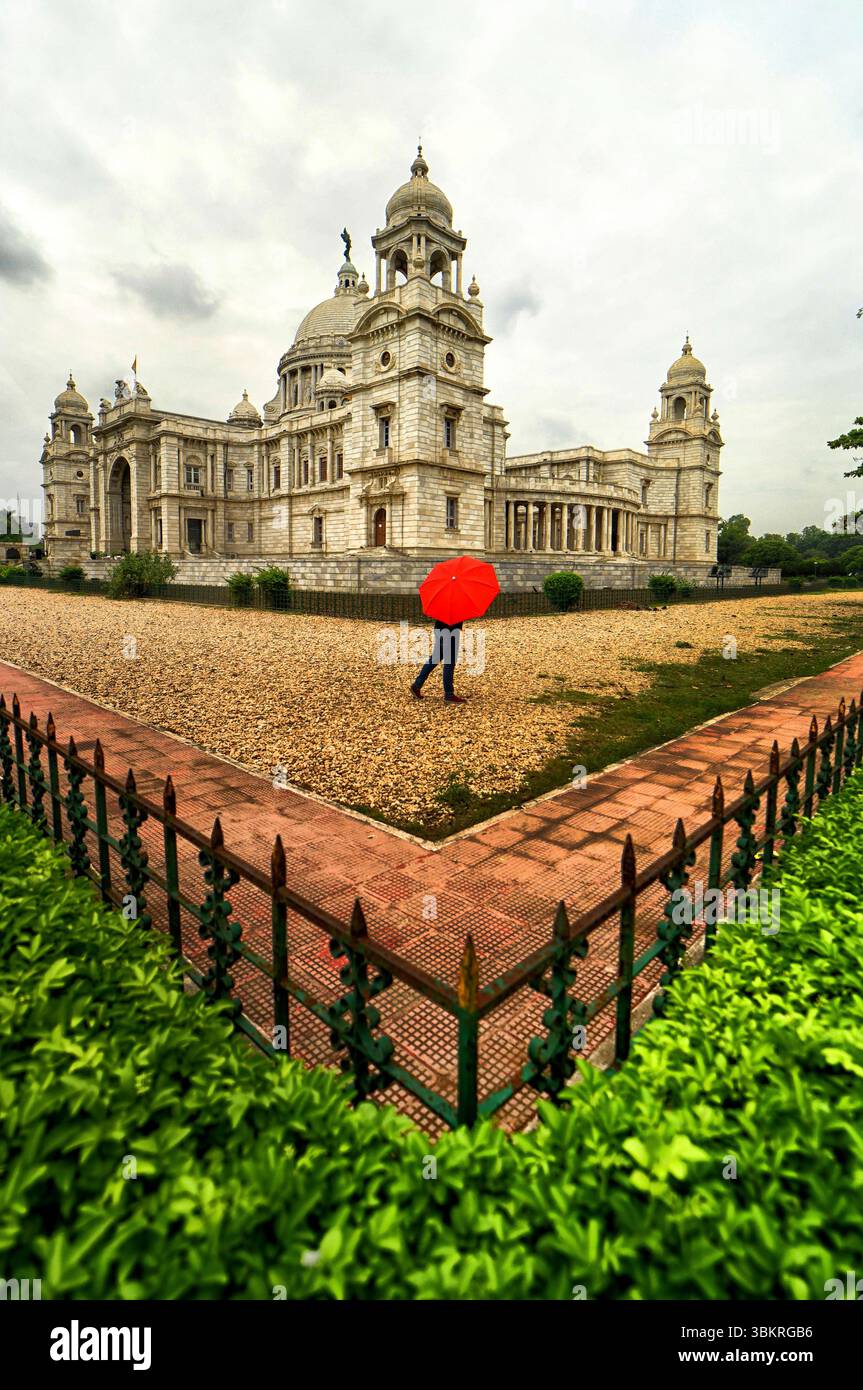 Kolkata, India. 21st June, 2025. A visitor seen walking with a red ...