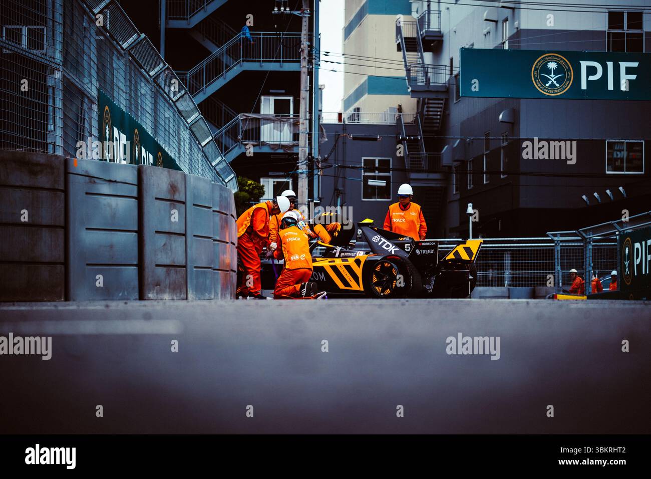 The crashed car of Neom McLaren driver Taylor Barnard being tended to ...
