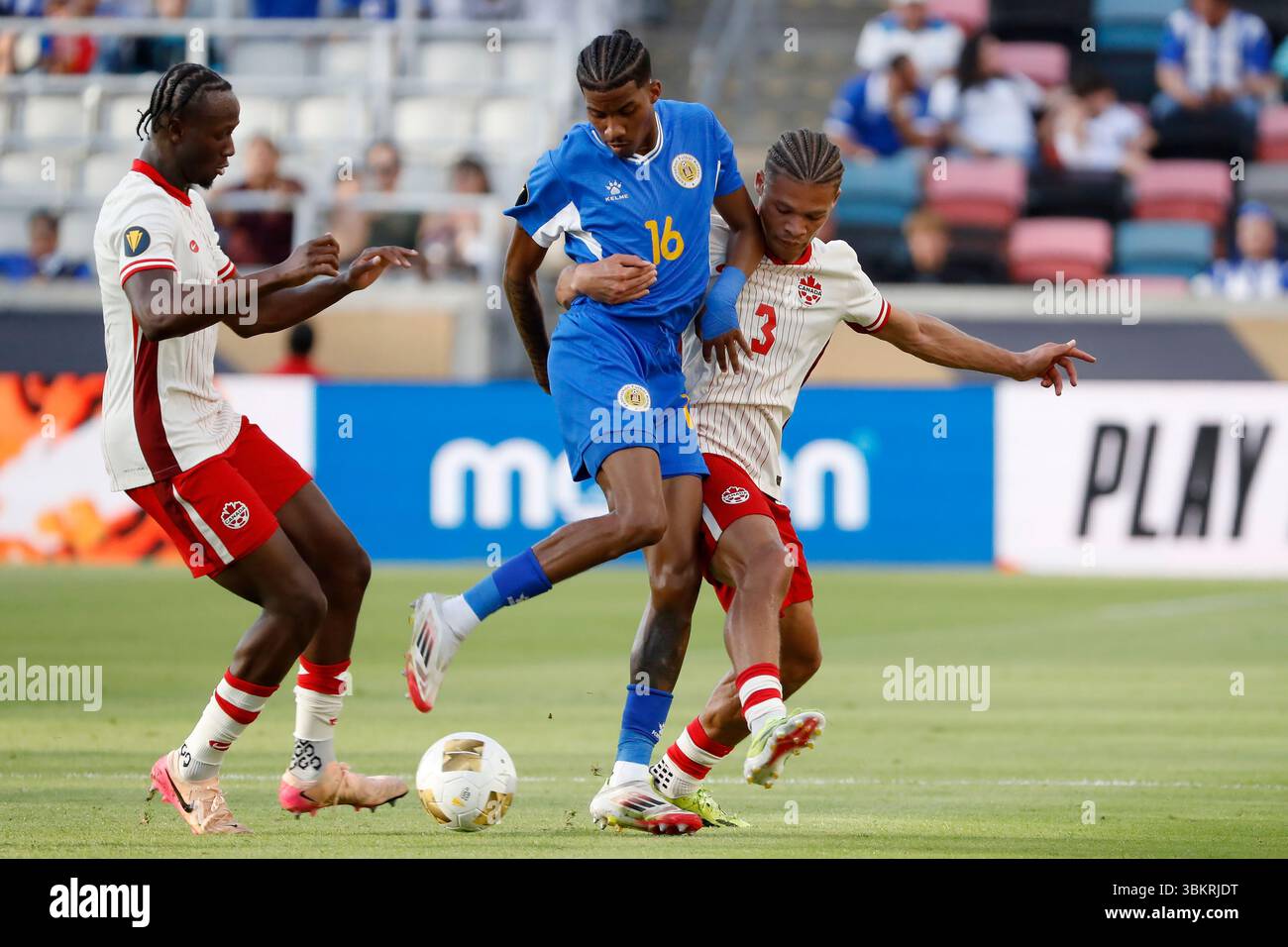Curacao's Jearl Margaritha (16) is pulled off the ball by Canada's ...