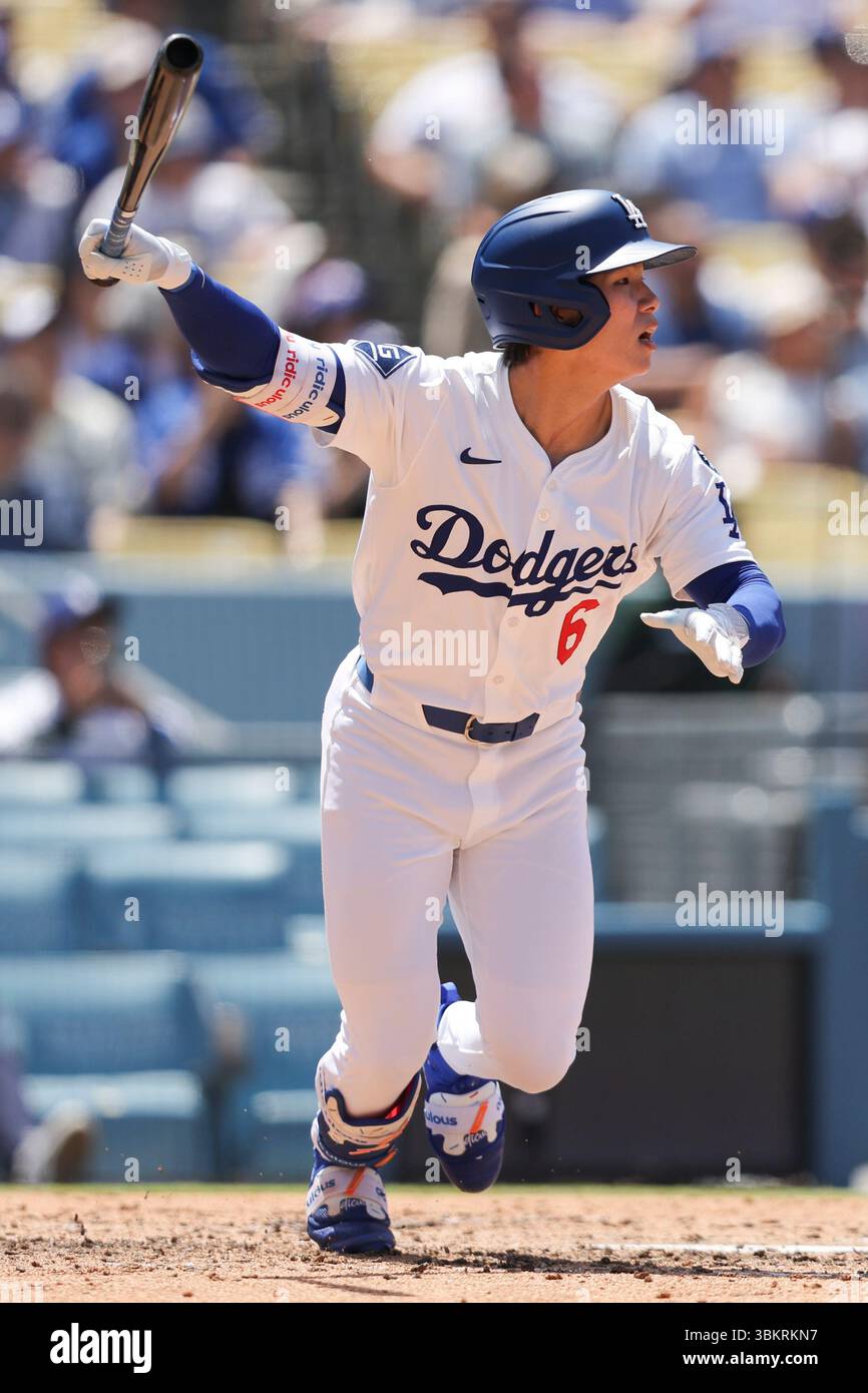 Los Angeles Dodgers' Hyeseong Kim follows through on a double during ...