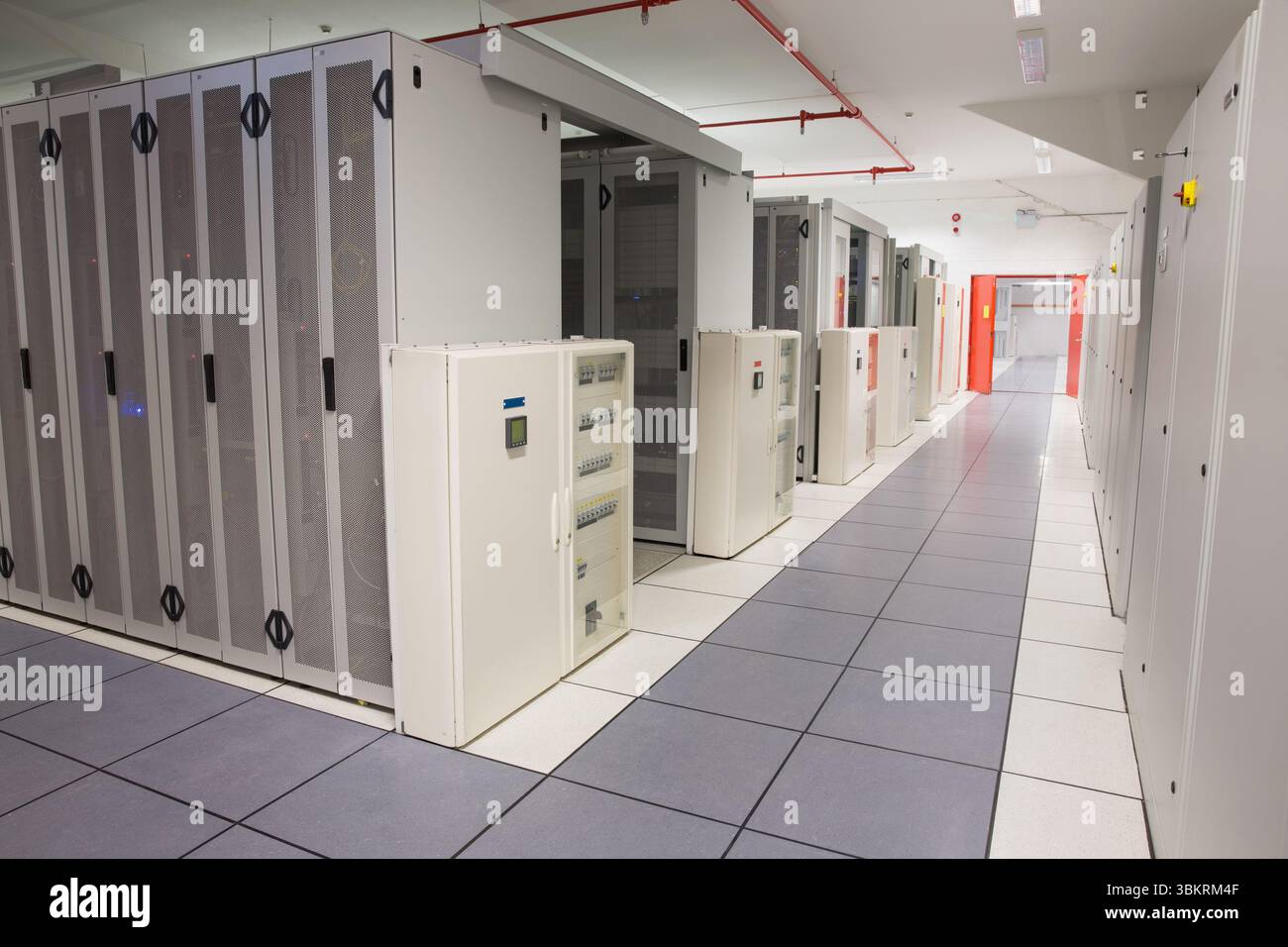 Server racks and PDUs lining 3D render data center corridor, showing ...
