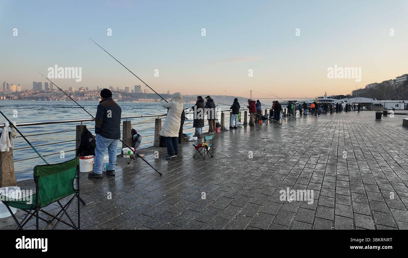 turkey istanbul 12 june 2025. Fishermen casting lines at dawn by the ...