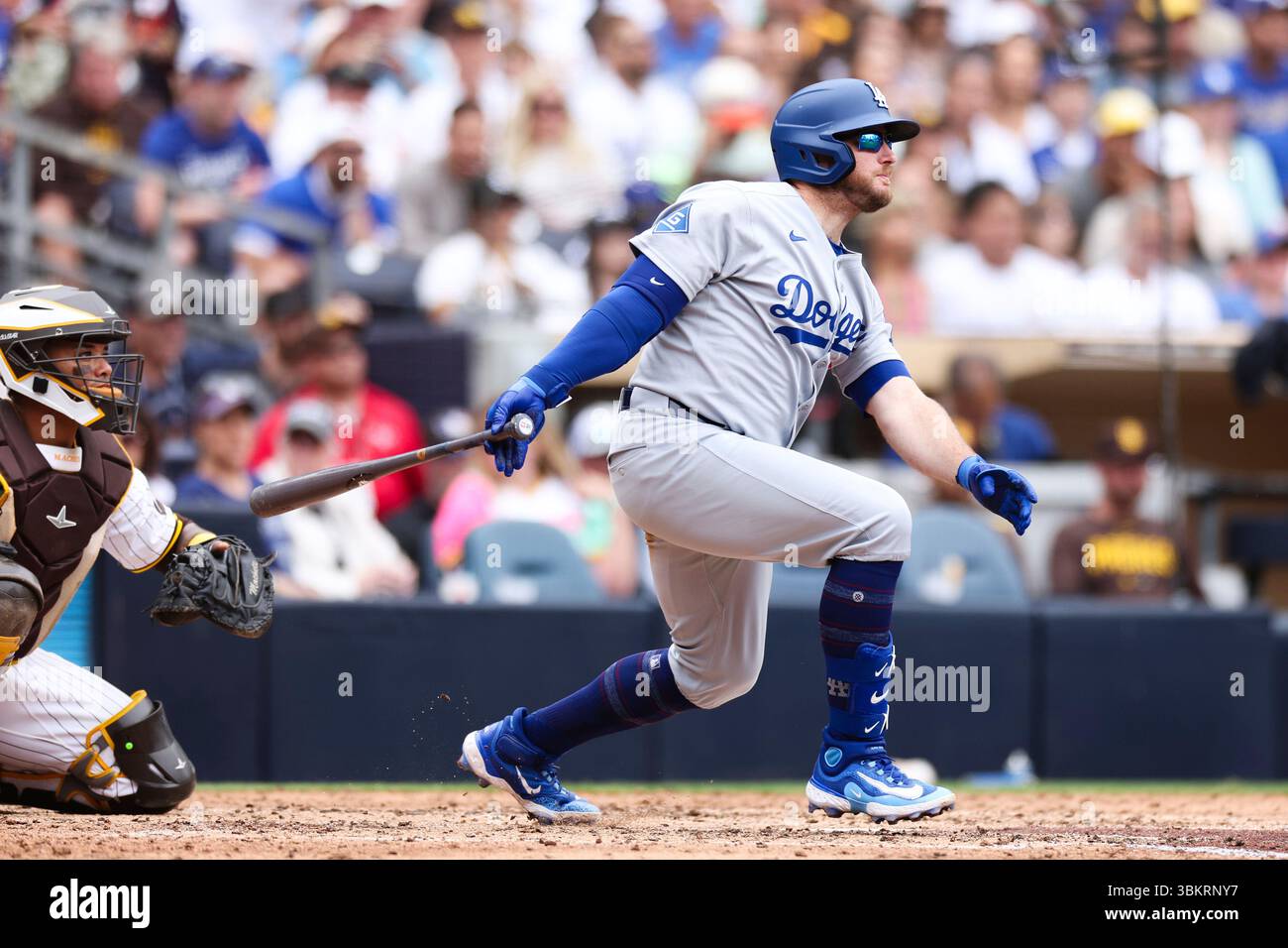 Los Angeles Dodgers' Max Muncy watches his hit against the San Diego ...