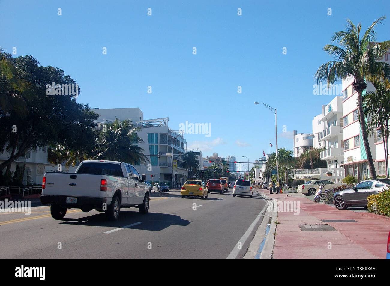Busy street in Miami Beach, Florida, with Art Deco buildings, palm ...