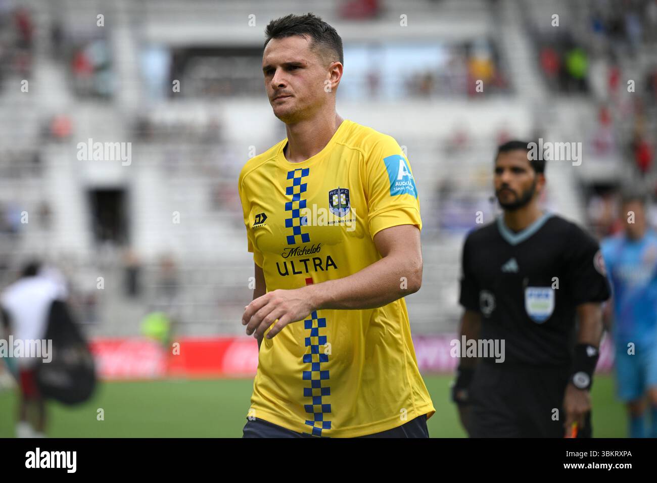 Auckland City's Adam Mitchell leaves the pitch after the first half of ...