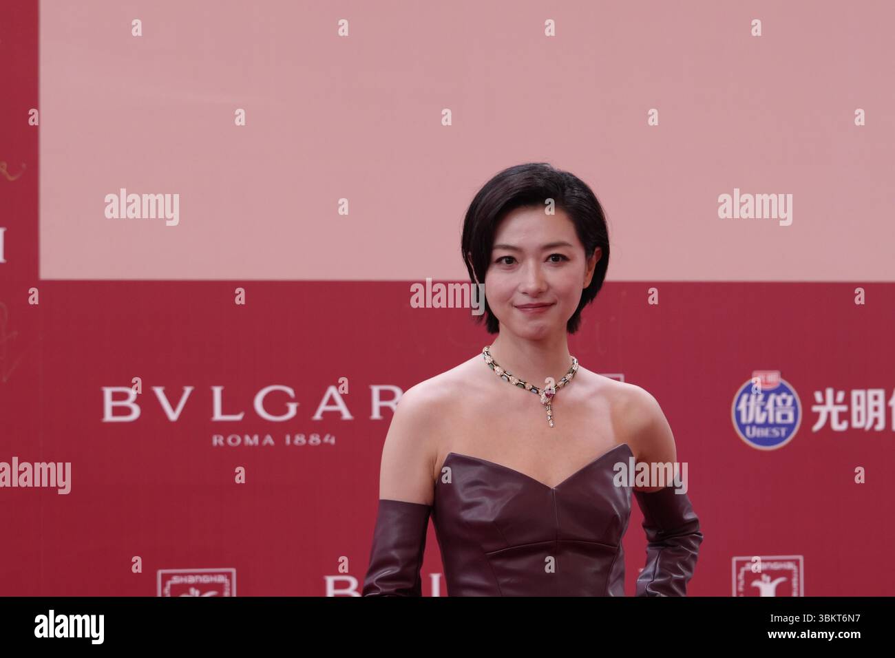 Chinese actress and singer Wan Qian poses for a photo on the red carpet ...
