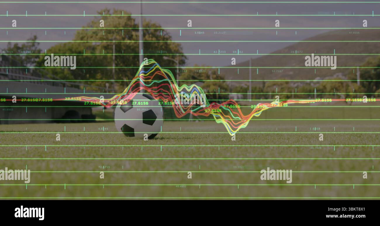 Showing soccer ball resting on field by arched pavilion and goalpost ...