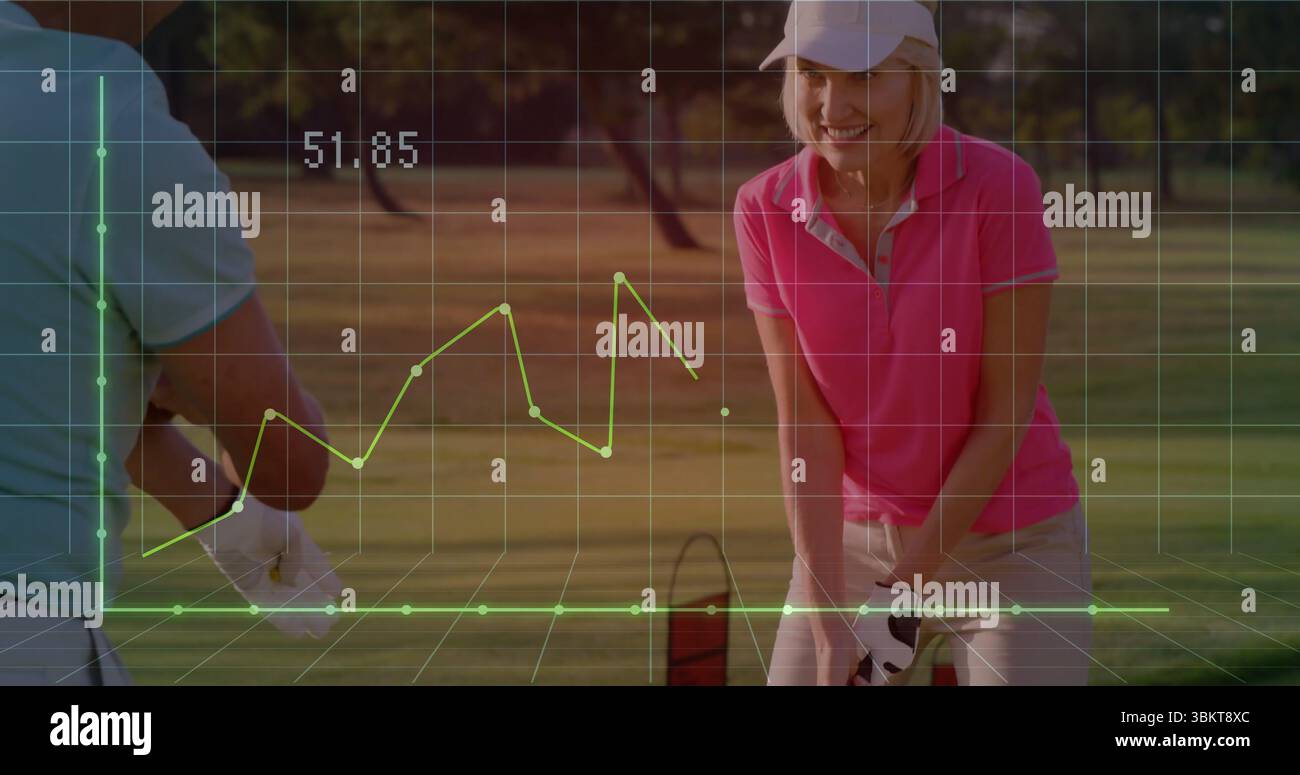 Standing golfers in pink polo and blue polo on fairway holding clubs ...