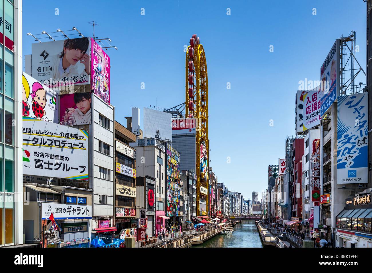 Dotonbori is a principal tourist destination in Osaka, running along ...