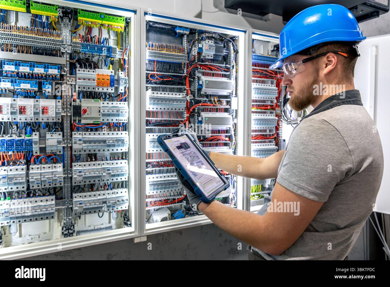 Switchboard check electrician tablet hi-res stock photography and ...