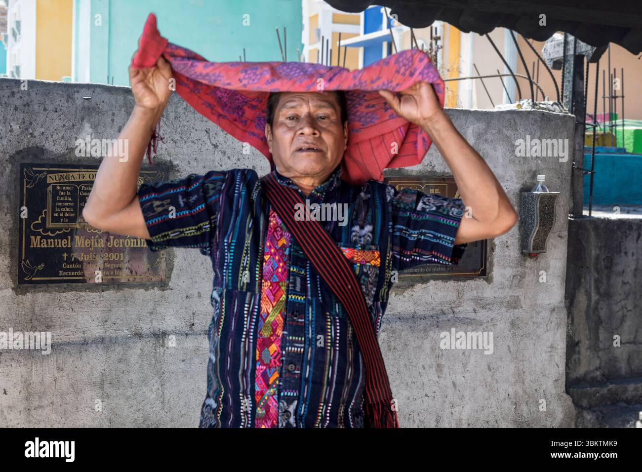 Mayan spiritual leader, chilan, putting on head covering, pre-ceremony ...